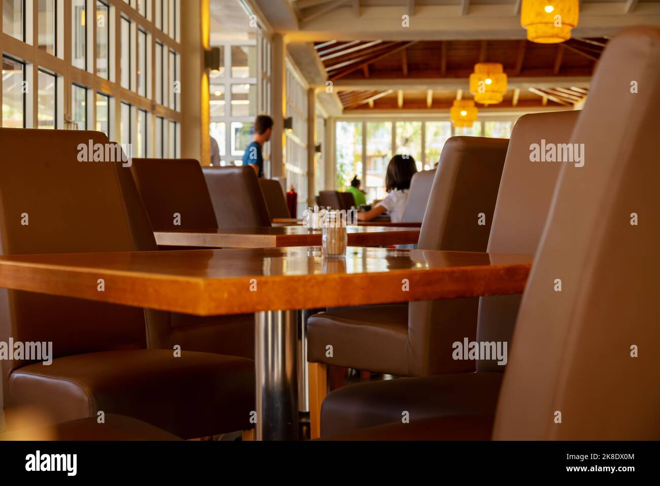 Blurred Photo Brown Tables and Chairs At Beach Restaurant. People Eat ...
