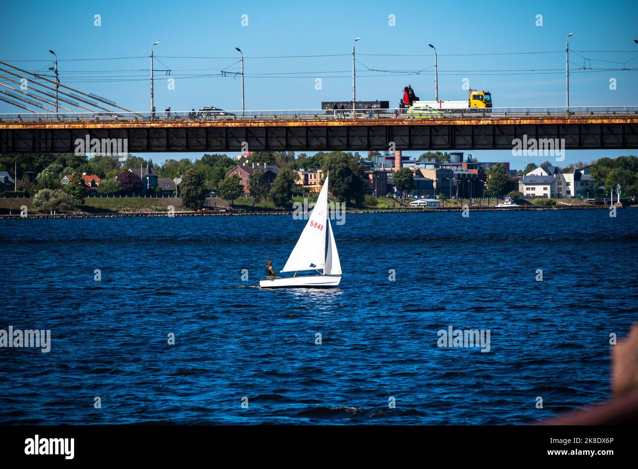 Riga, Latvia - 09102022: Man On Sailing Boat Daugava river, Cable ...