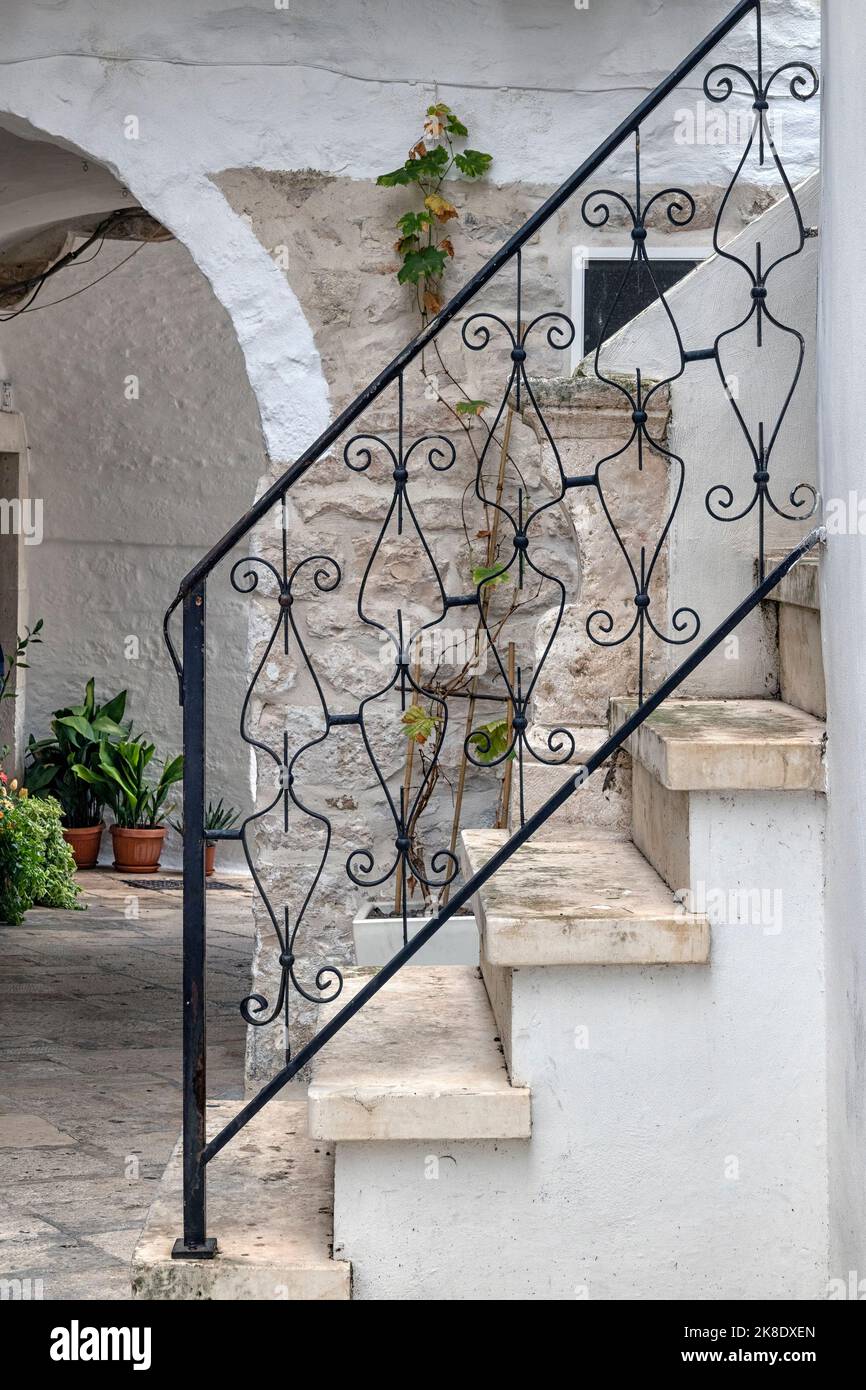 LOCOROTONDO, ITALY - OCTOBER 13, 2019: Attractive stairs in the town ...