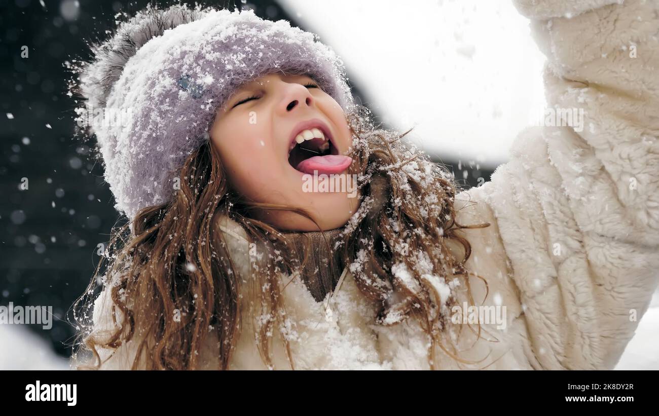 winter family fun. catch snowflakes with tongue. Happy cutie, pretty ...