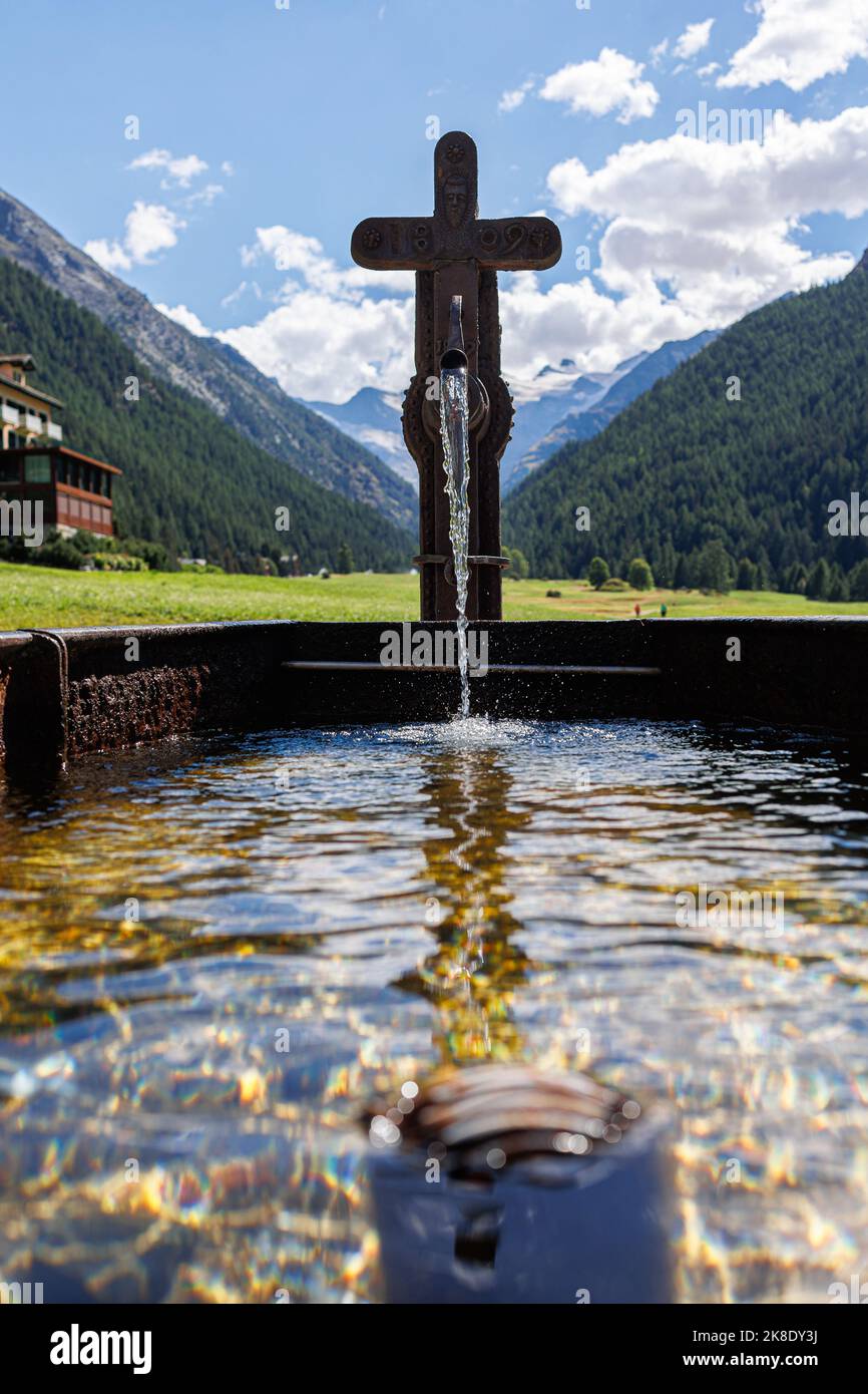 Iron Cross-shaped Fountain with Flowing Water set in a Mountain ...