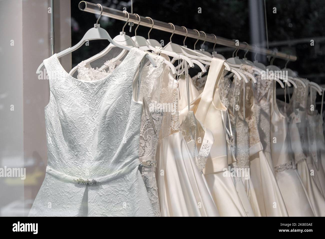 Beautiful bridal dress on hangers. Wedding dress close up at the ...