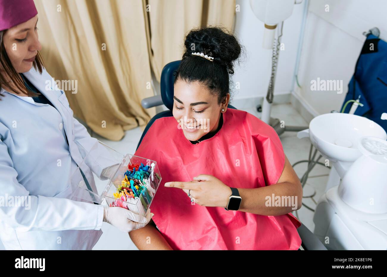 Patient with dentist choosing dental braces, Dental patient choosing ...