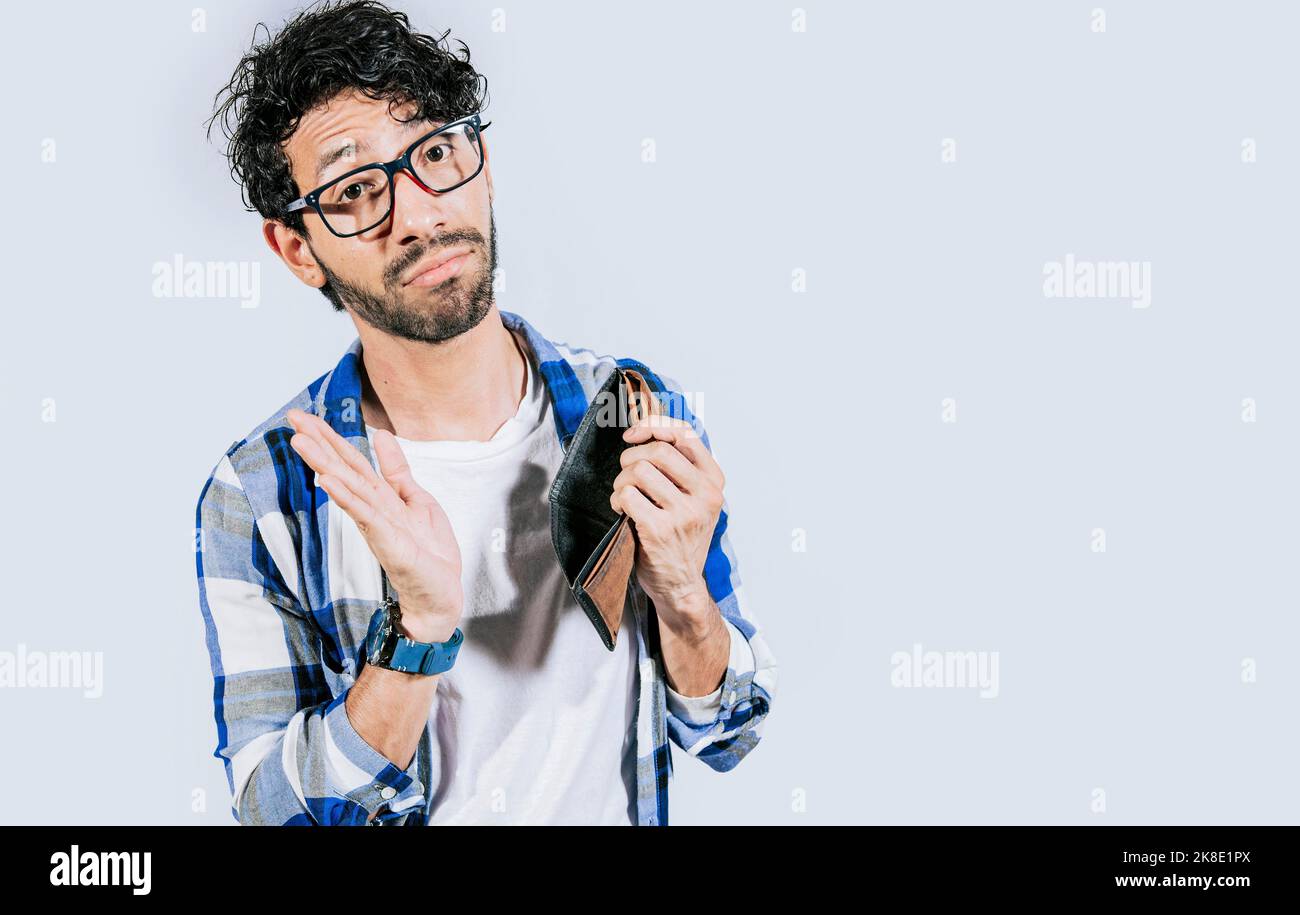 Sad person showing an empty wallet. Man with financial problems shaking ...