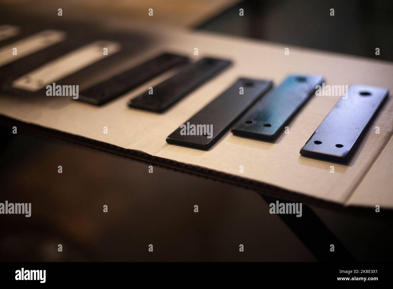 Steel blanks with holes. Metal painting. Details of workshop. Model ...