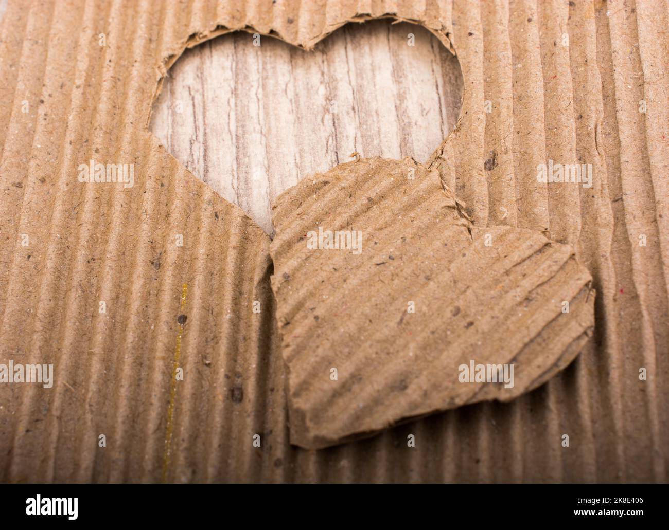 Heart shaped cut out of a brown cardboard Stock Photo - Alamy