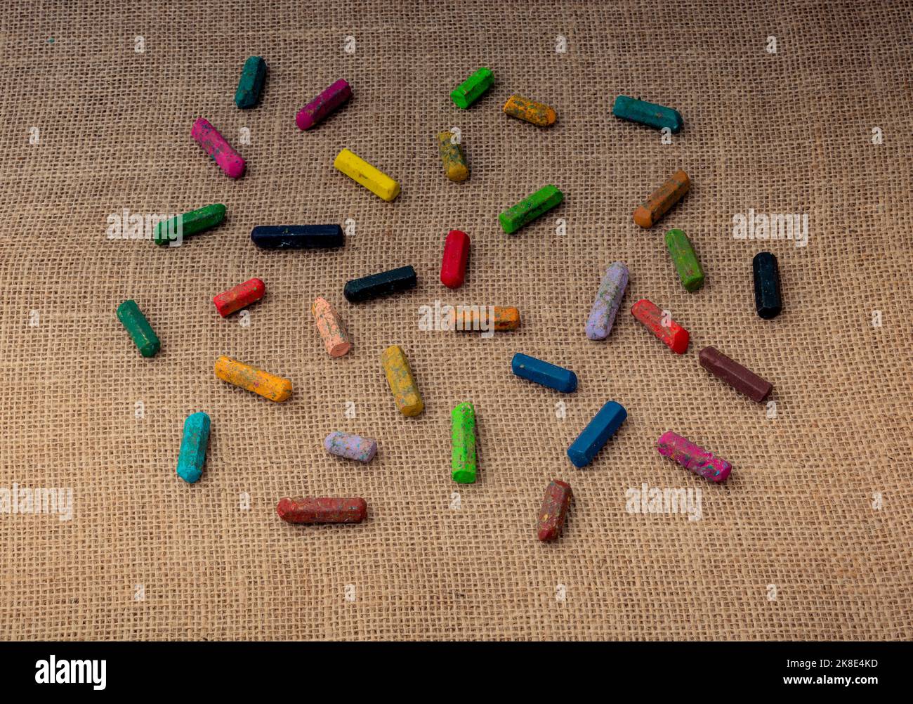 Used crayons of various color on a canvas Stock Photo - Alamy