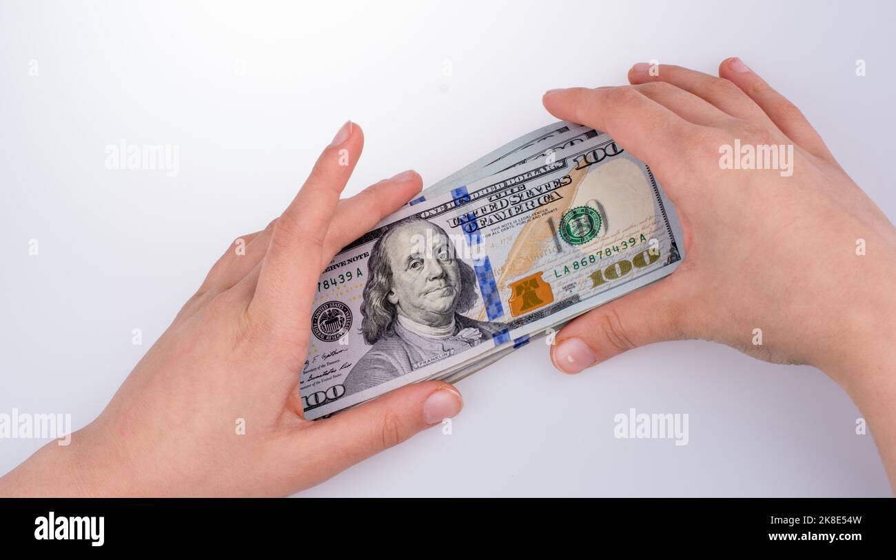 Human hand holding American dollar bill as money isolated on white ...