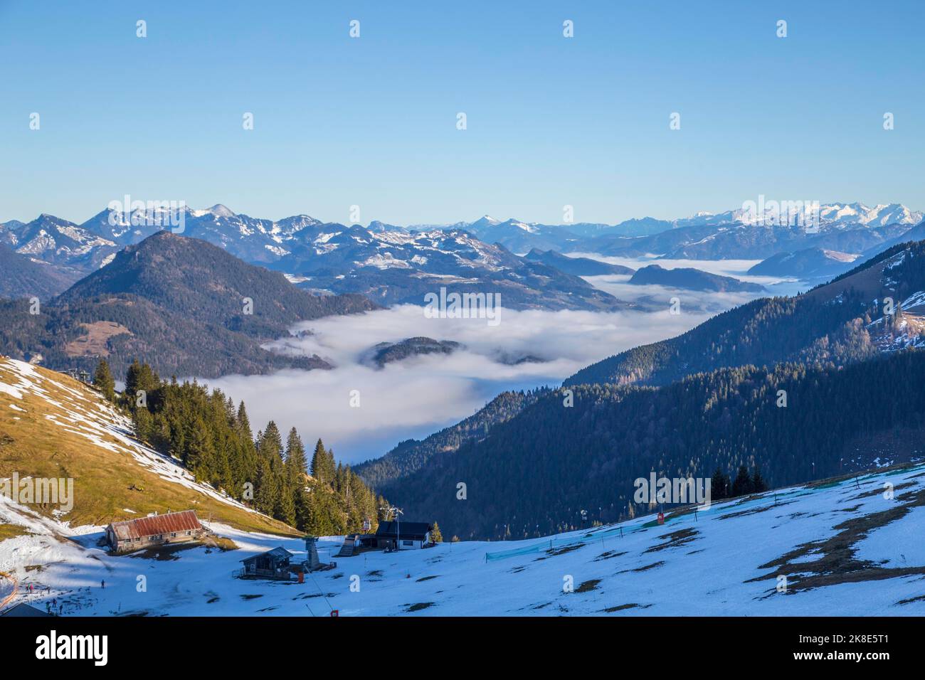View into the foggy Inn valley, Oberes Sudelfeld ski area, Bayrischzell ...