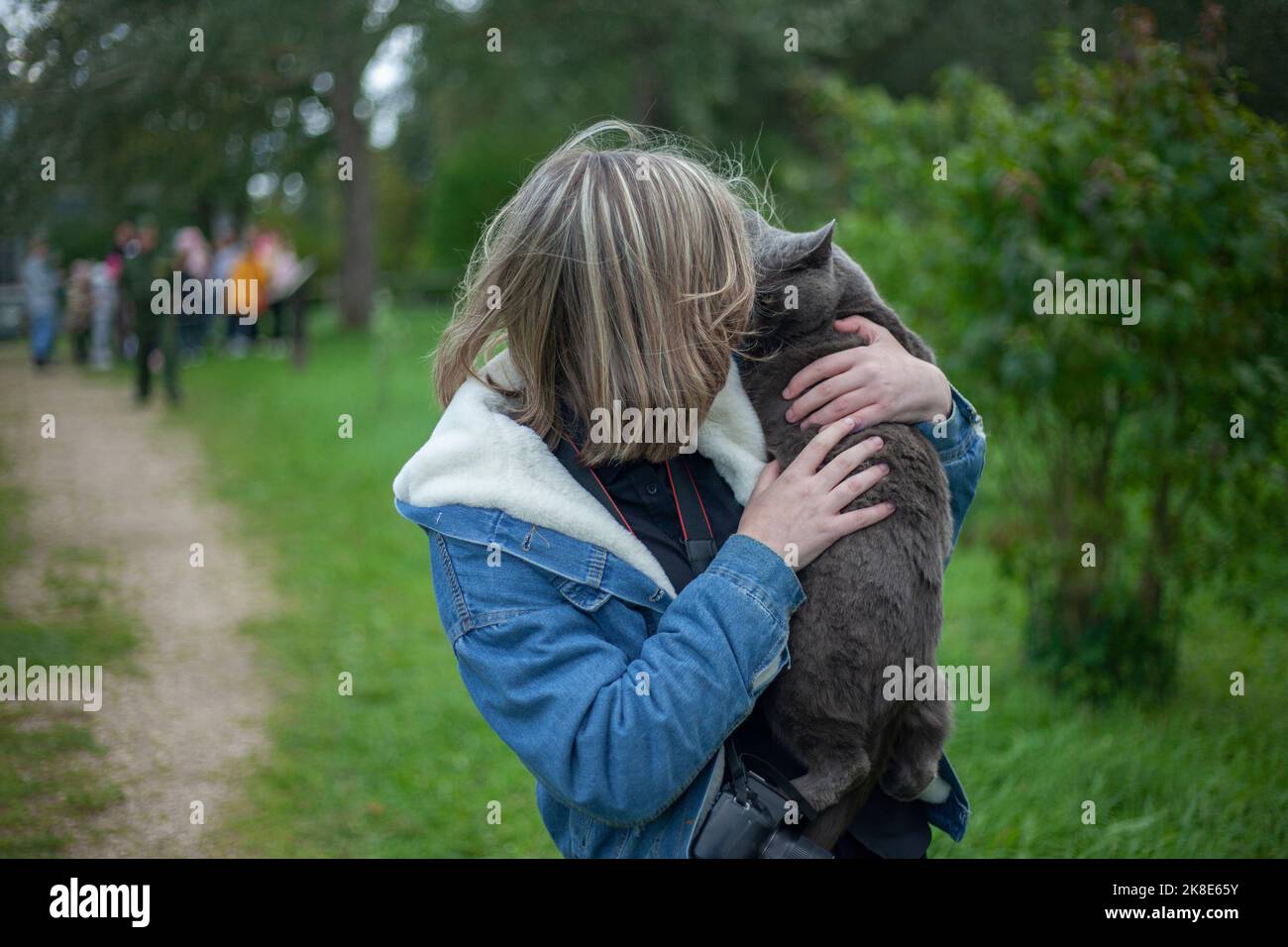 Man holding cat in arms hi-res stock photography and images - Alamy