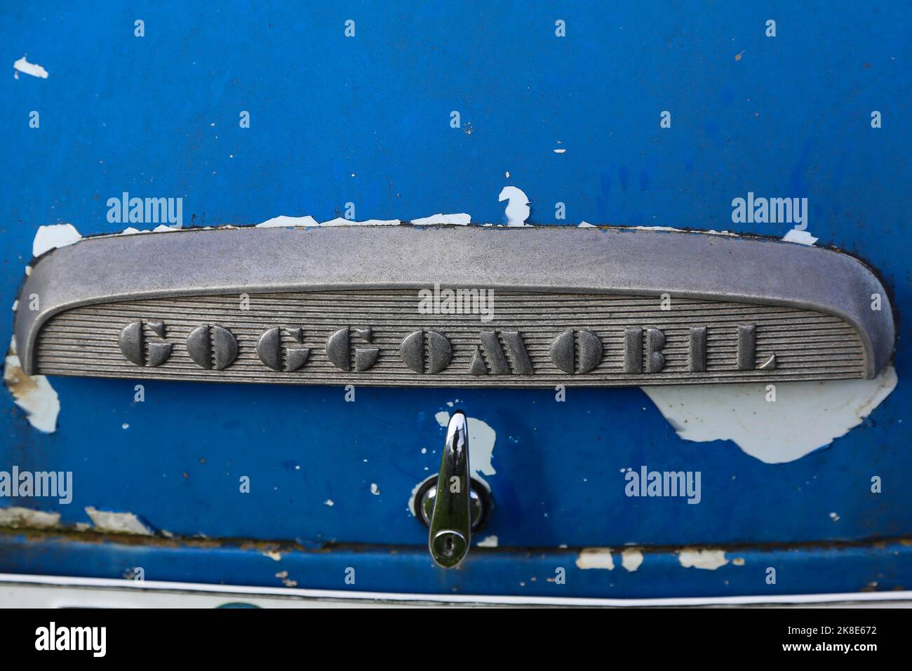 Detail of a classic car, boot, lever, handle, blue Goggomobil, damaged ...