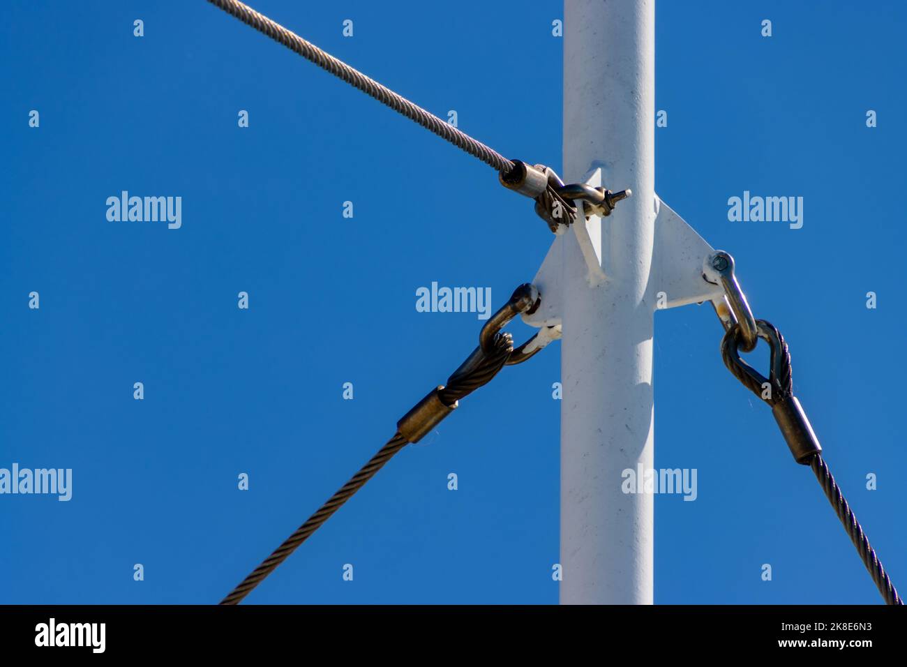 Metal pole with three steel cables attached for stability Stock Photo ...