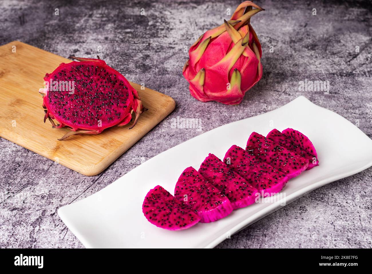 Pitaya or dragon fruit, half a pitahaya exposing the pink interior with ...
