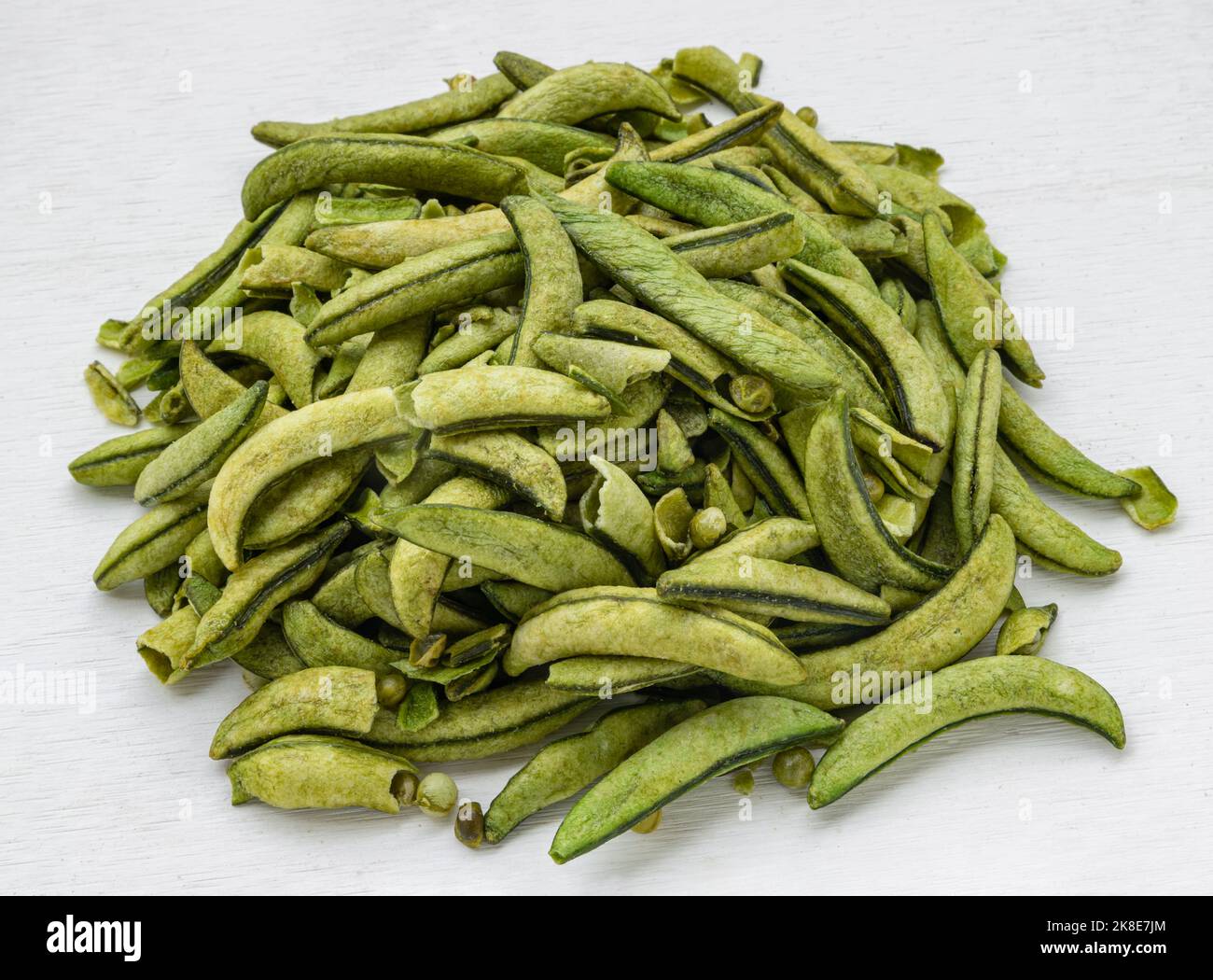 A lot of Healthy roasted sugar snap peas on white background. Copy ...