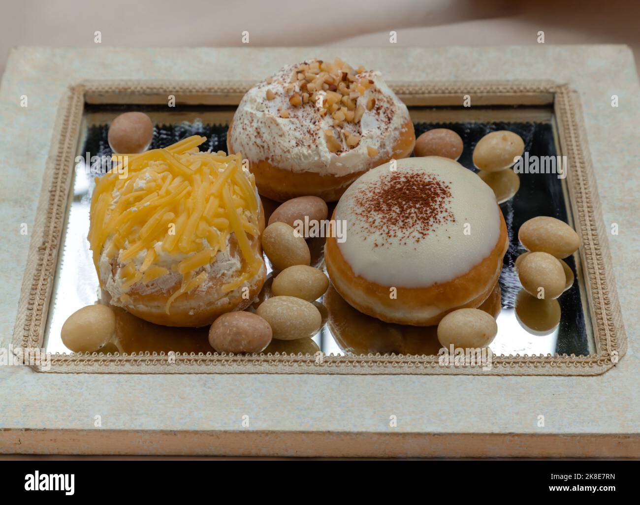 Three doughnuts covered with Cookies and Creme, Butter Cheese ...