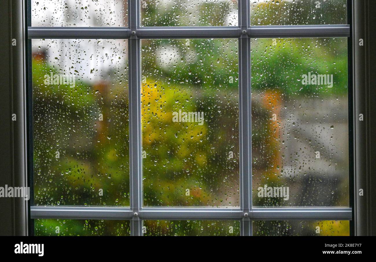 Raindrops on a glass window pane during wet weather England UK Stock Photo - Alamy