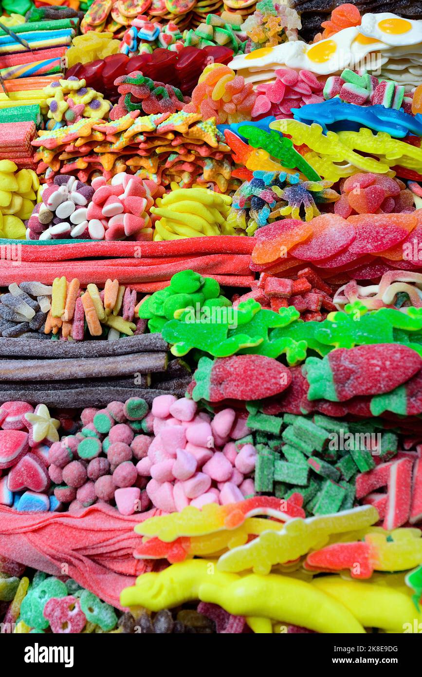 Assorted Colorful Candies and sweets in a market. La Boqueria, the most ...