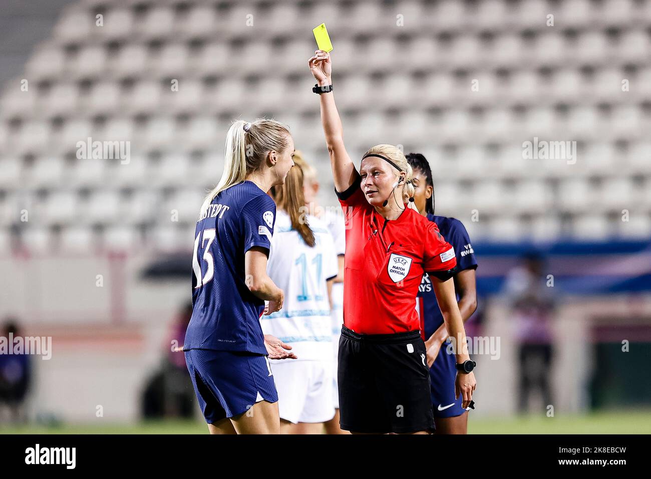 PARIS, FRANCE - OCTOBER 20: Referee Ewa Augustyn (R) shows a yellow ...
