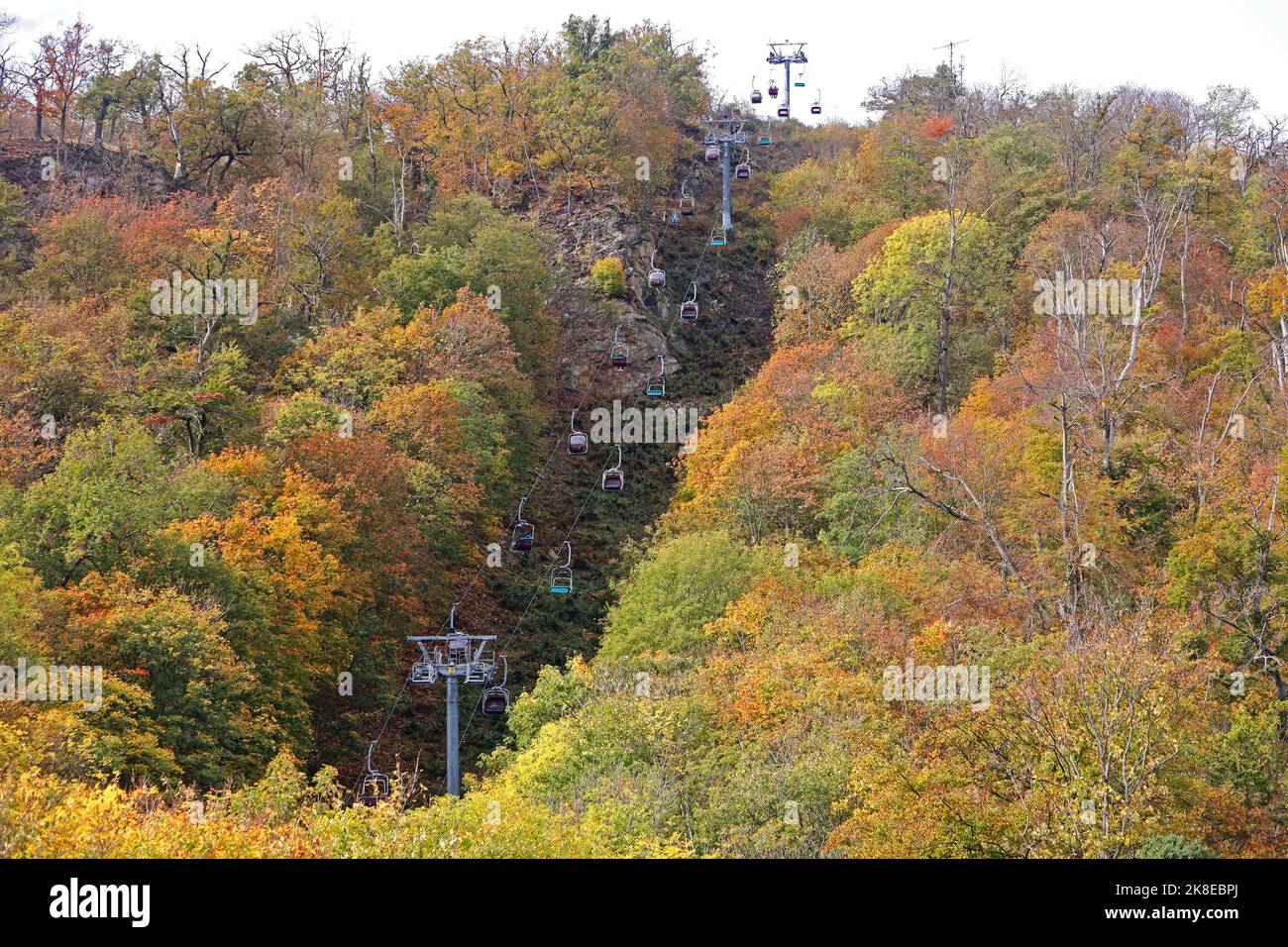 Thale, Germany. 23rd Oct, 2022. Visitors take the chairlift to the ...
