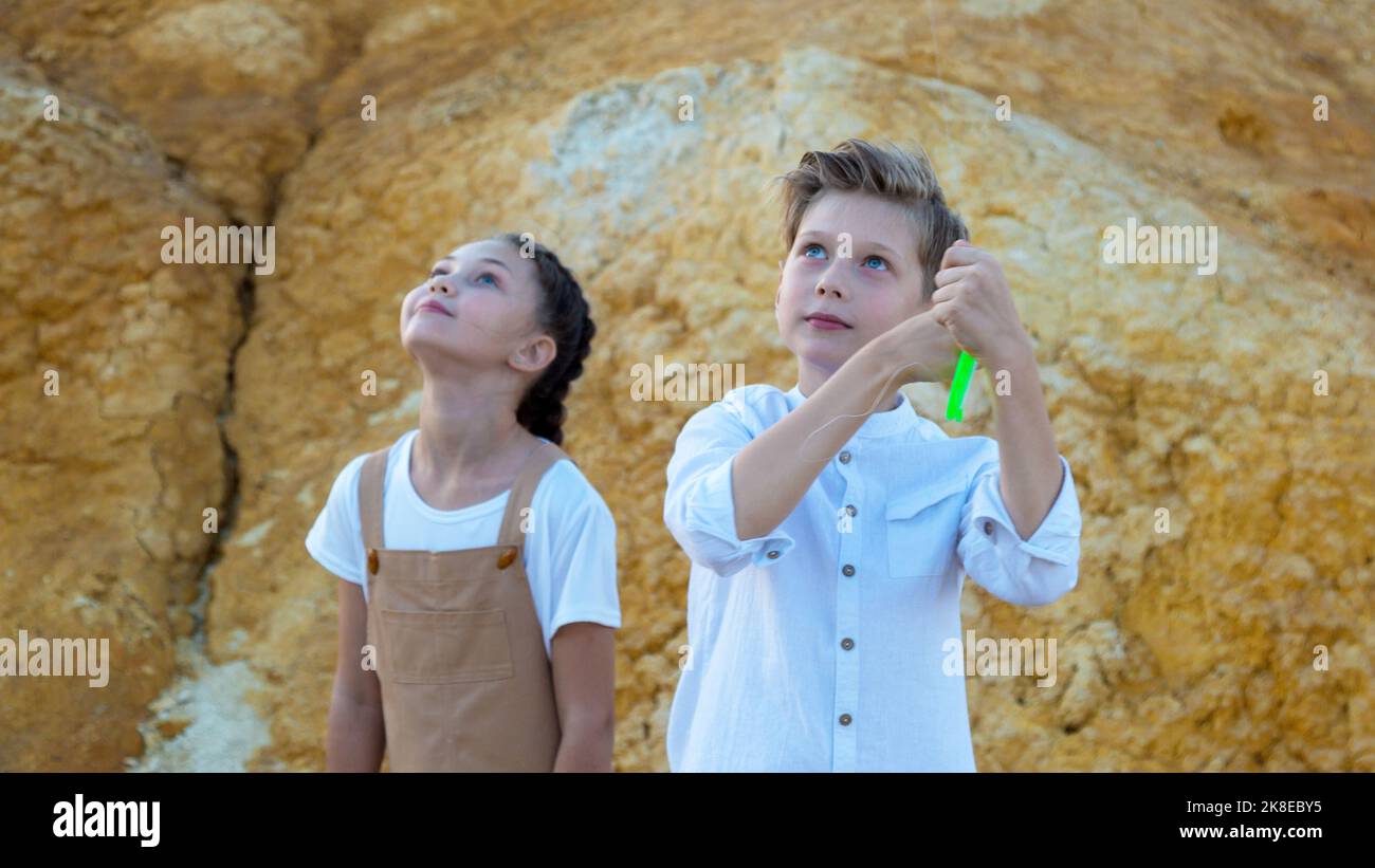 Surprised faces of children watching kite flying sky Stock Photo - Alamy