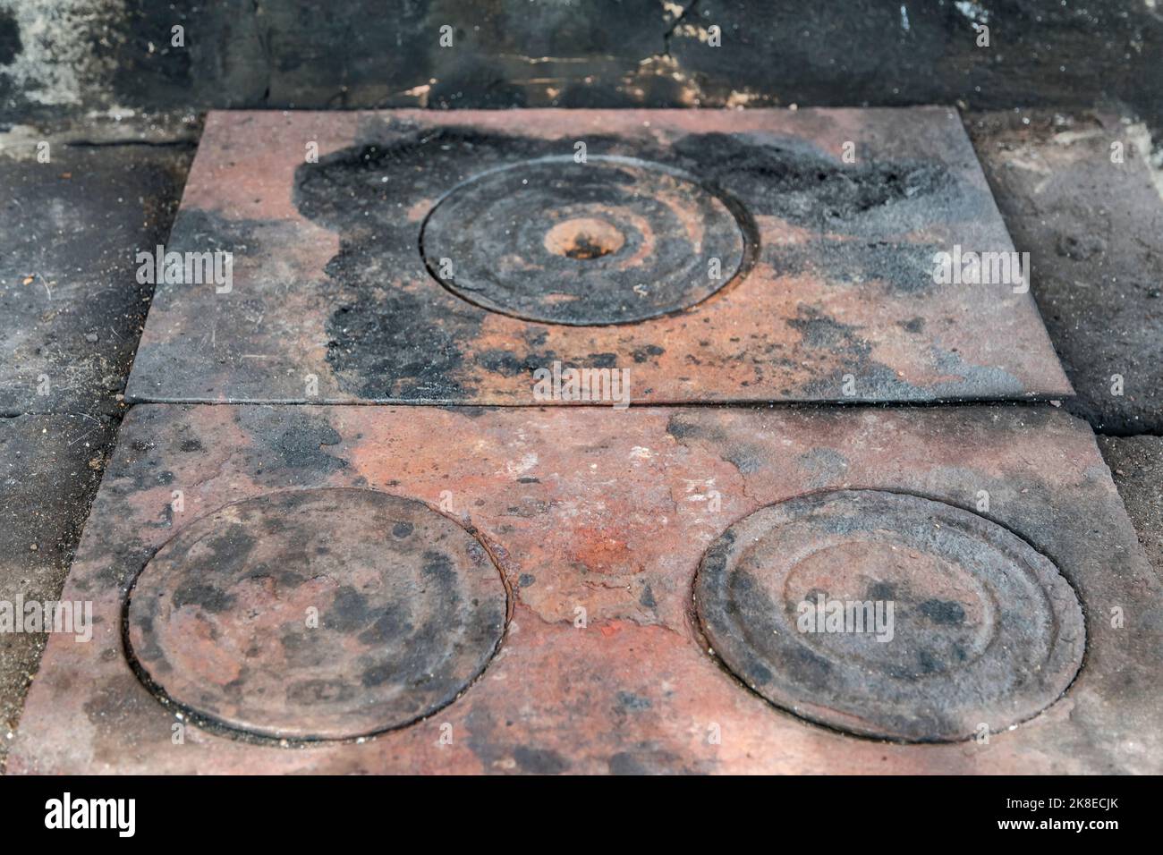 Old weathered cast iron slab on outdoor hearth in country yard Stock ...