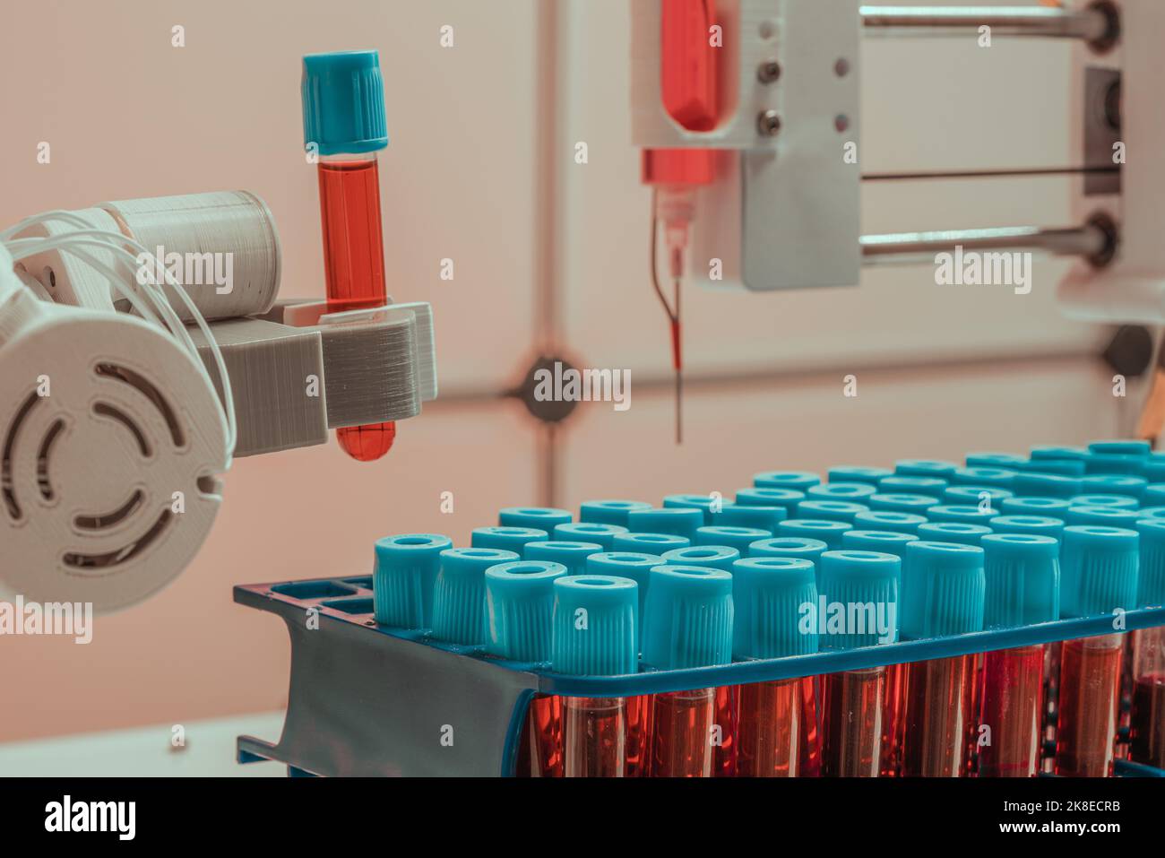 modern genetic laboratory PCR processor and robot with test tube in ...