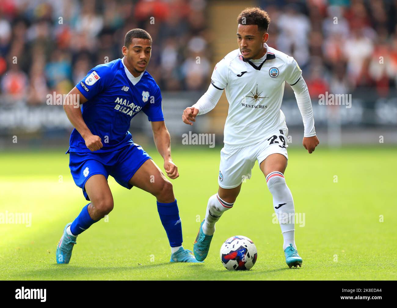 Cardiff City's Andy Rinomhota (left) and Swansea City's Matthew ...