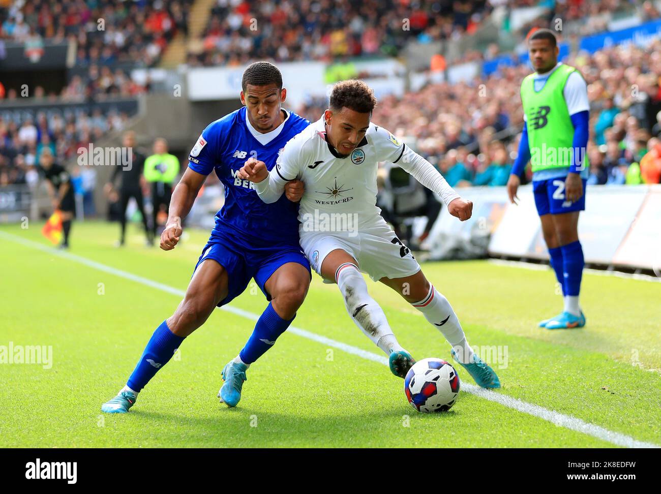 Cardiff City's Andy Rinomhota (left) and Swansea City's Matthew ...