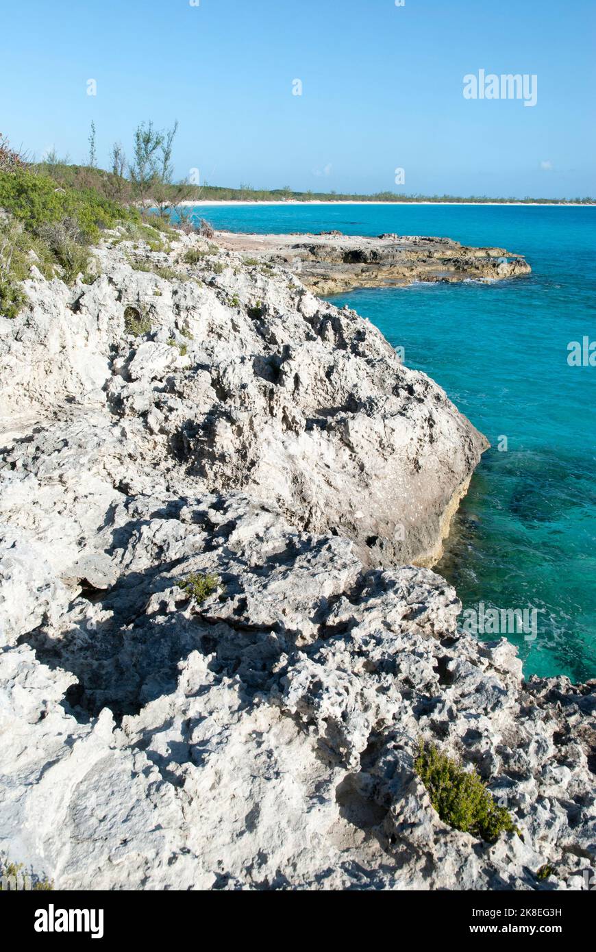 Sharp rocky coastline next to sandy beach on uninhabited Half Moon Cay ...