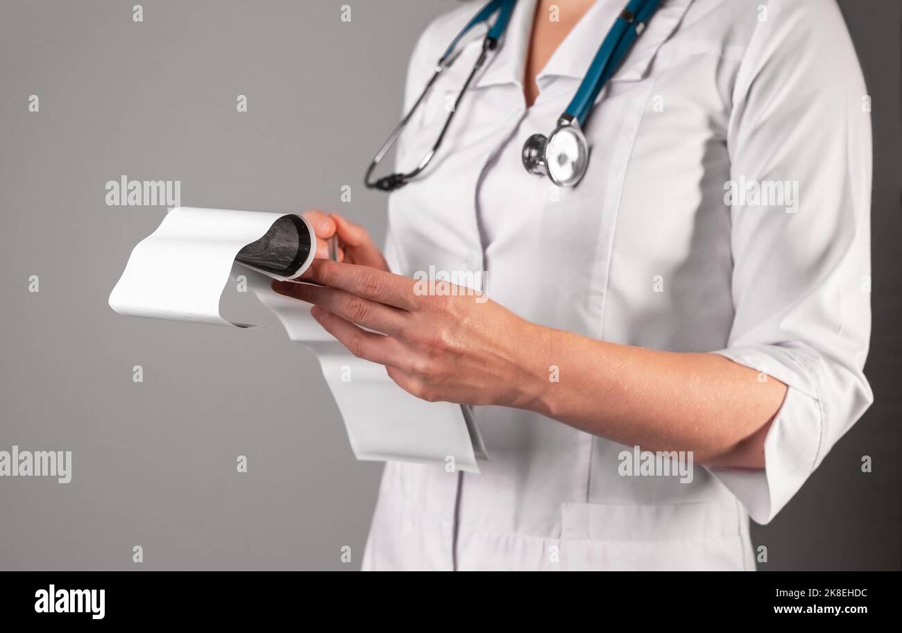 Doctors hand holding, studying medical documents, ultrasound scan. High ...