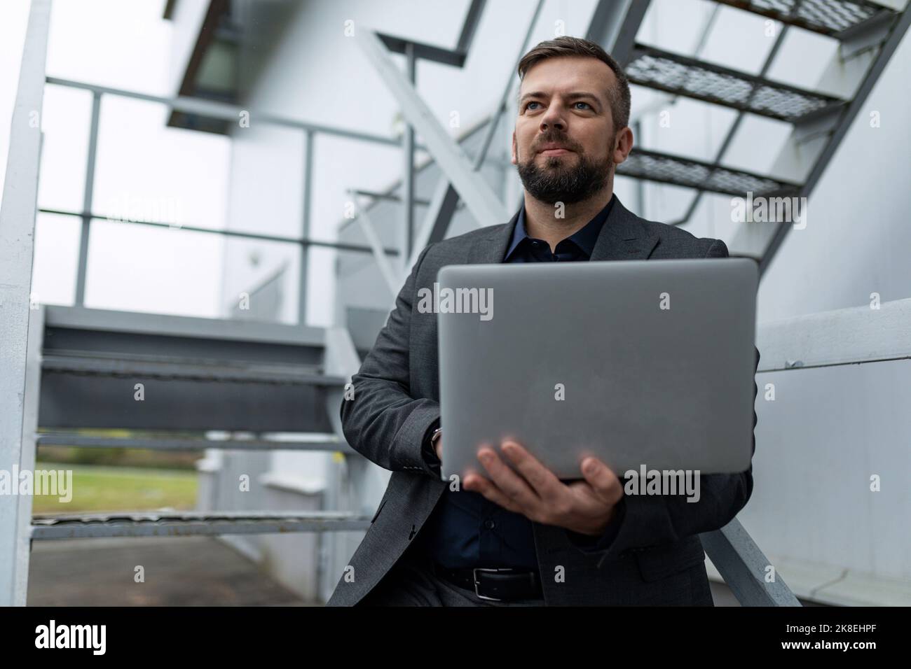 business man with laptop working outside the office Stock Photo - Alamy