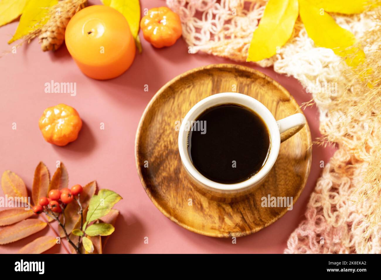 Autumnal breakfast. Composition fall leaves, hot cup of coffee and warm ...