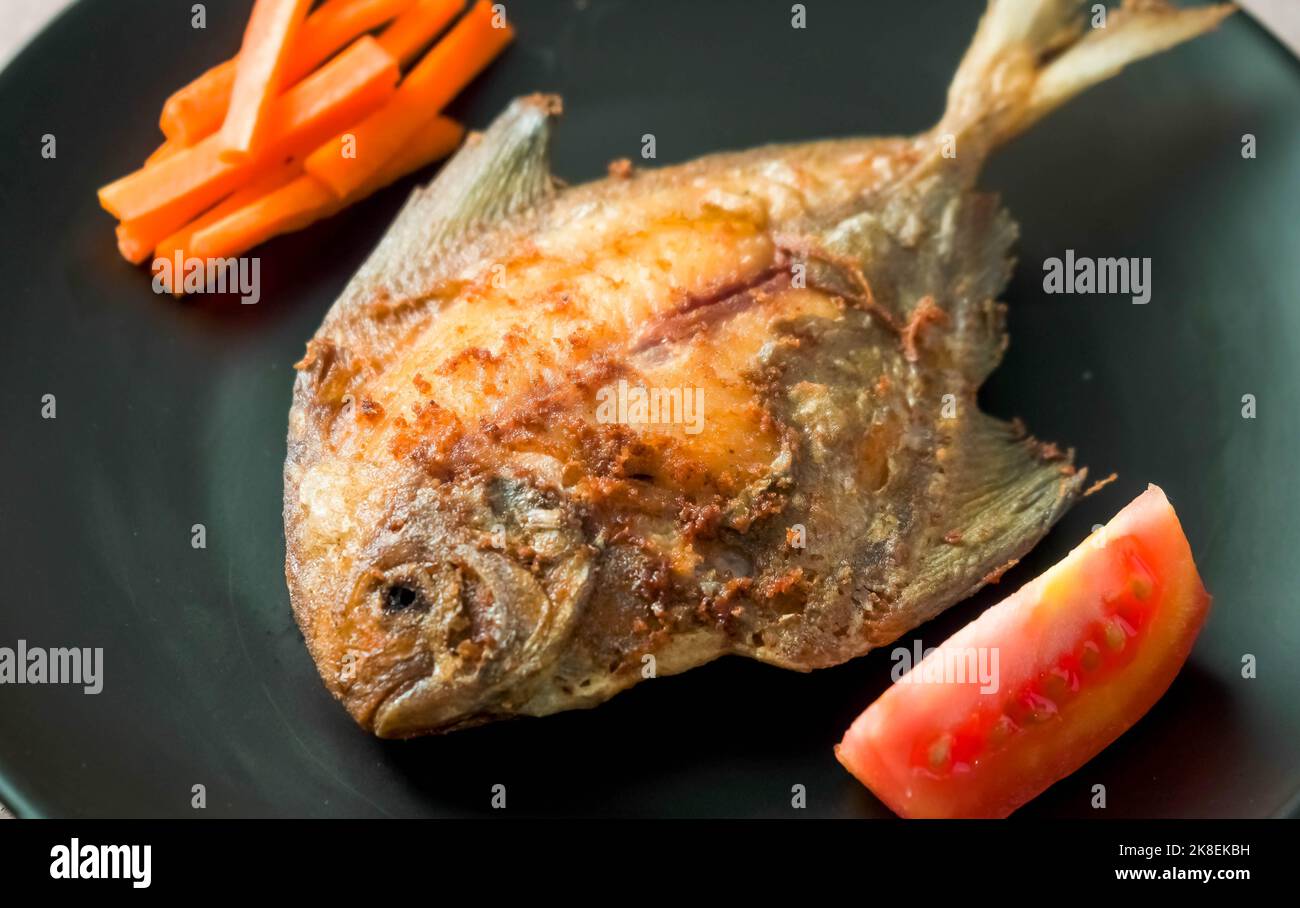 pomfret fish or ikan Bawal, that have been cooked or fryied well Stock ...