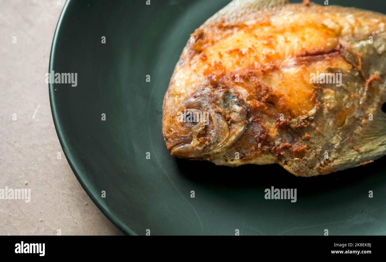 pomfret fish or ikan Bawal, that have been cooked or fryied well Stock ...