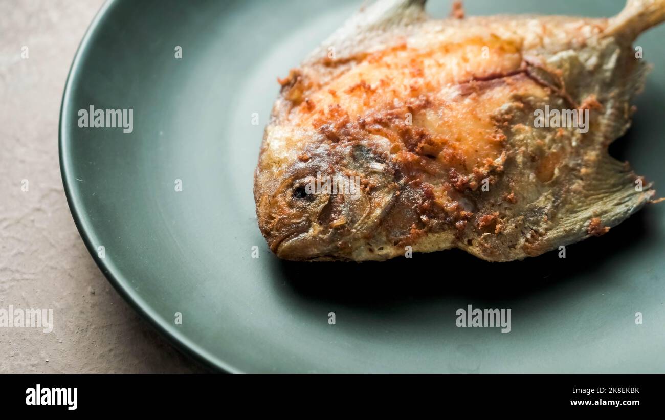 pomfret fish or ikan Bawal, that have been cooked or fryied well Stock ...