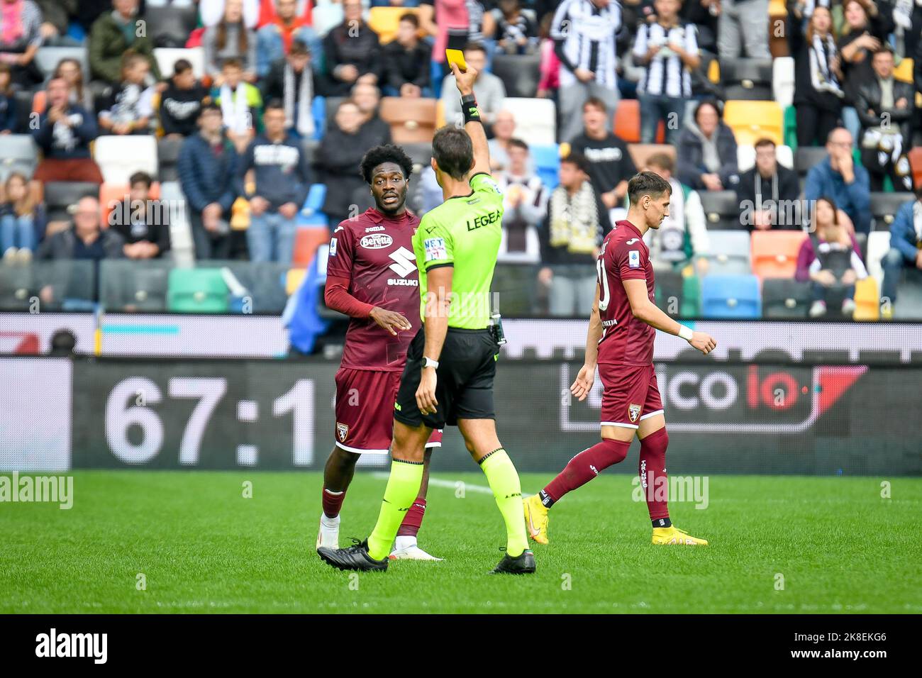 The referee of the match Matteo Marchetti shows yellow card to Torino's ...