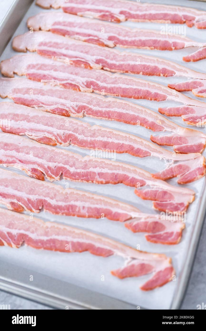Cooking bacon strips Stock Photo - Alamy