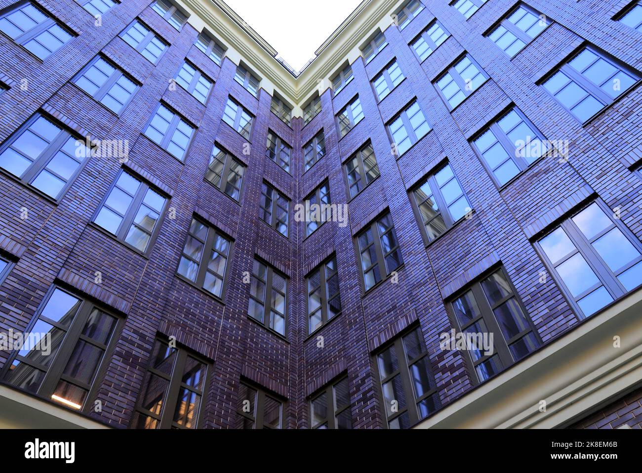Purple inner corner of building. House with large panoramic windows ...
