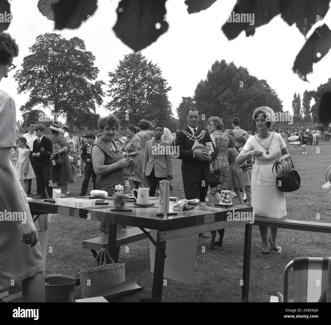 1964, historical, the wife of a mayor, holding rings or hoops, playing ...