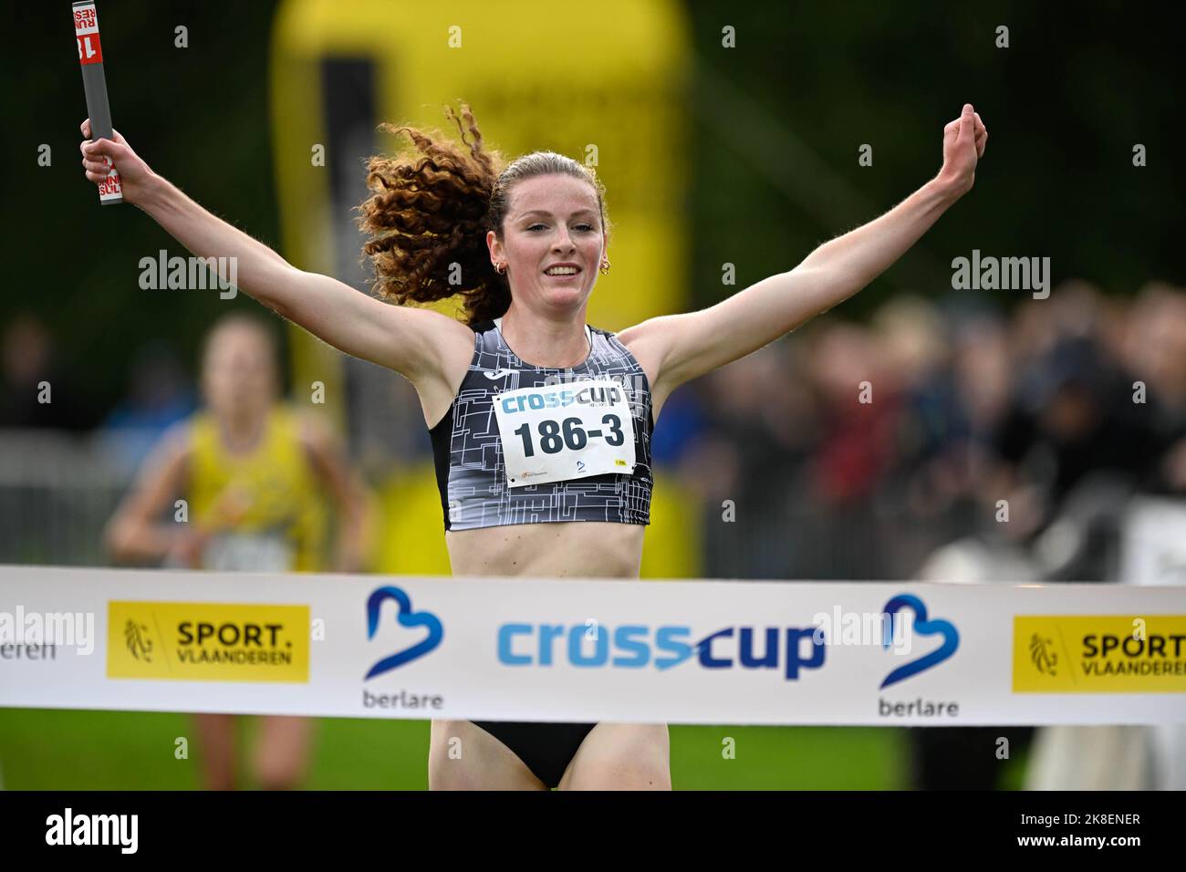 Belgian Lisa Rooms celebrates as she crosses the finish line to win the ...