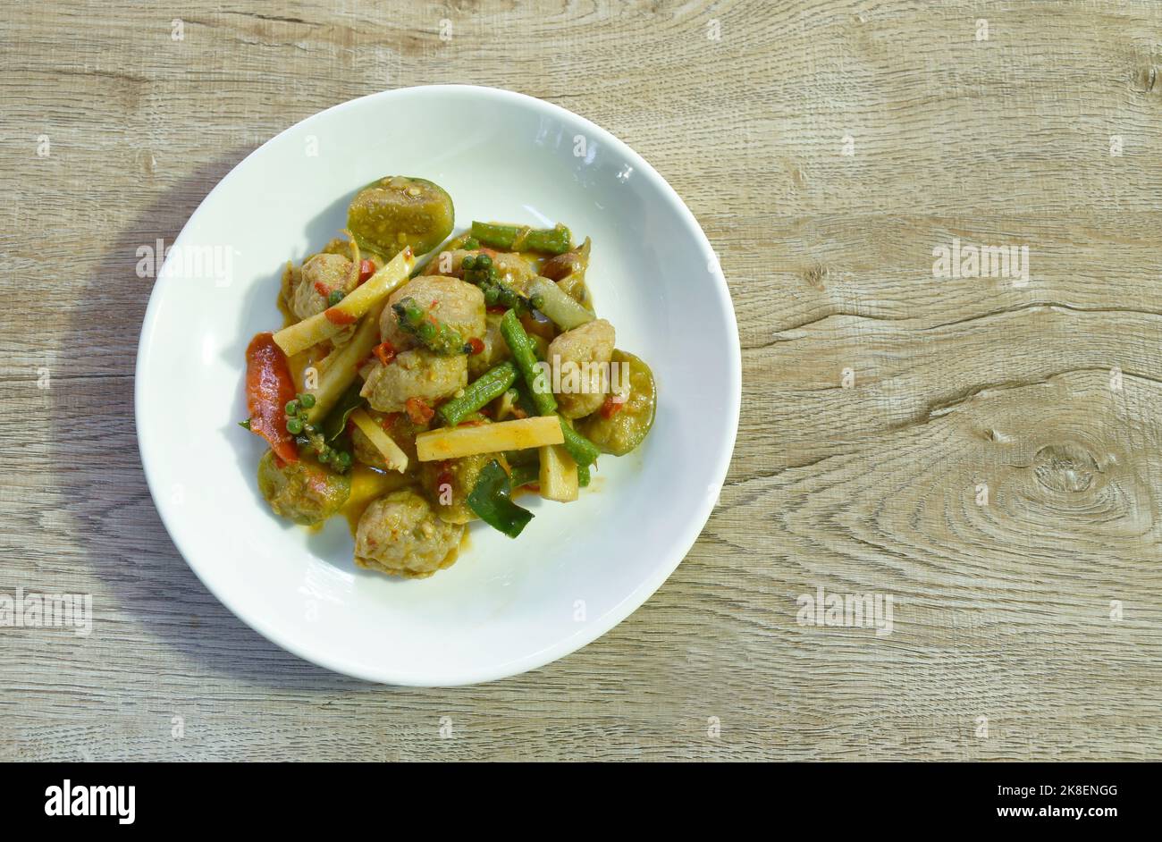 spicy fried slice fresh coconut shoot with fish ball in curry on plate ...