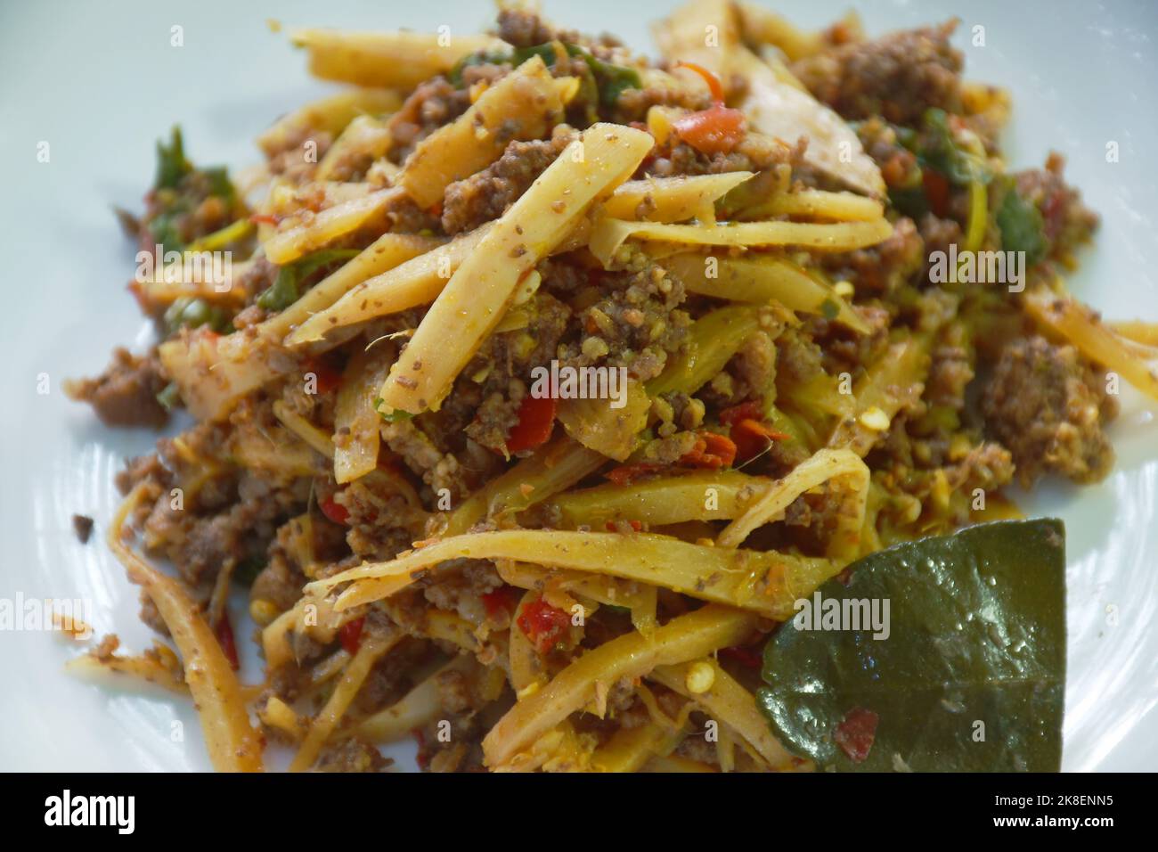 spicy stir fried bamboo shoot and chop beef meat with basil leaf on ...