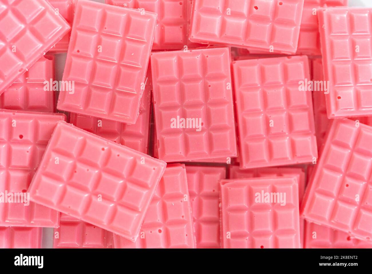 Mini pink chocolates Stock Photo - Alamy