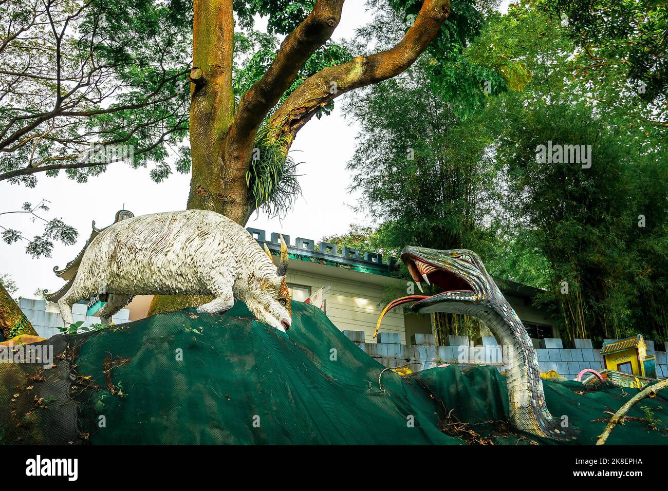 Goat fighting a giant snake at Haw Par Villa. This park has statues and ...