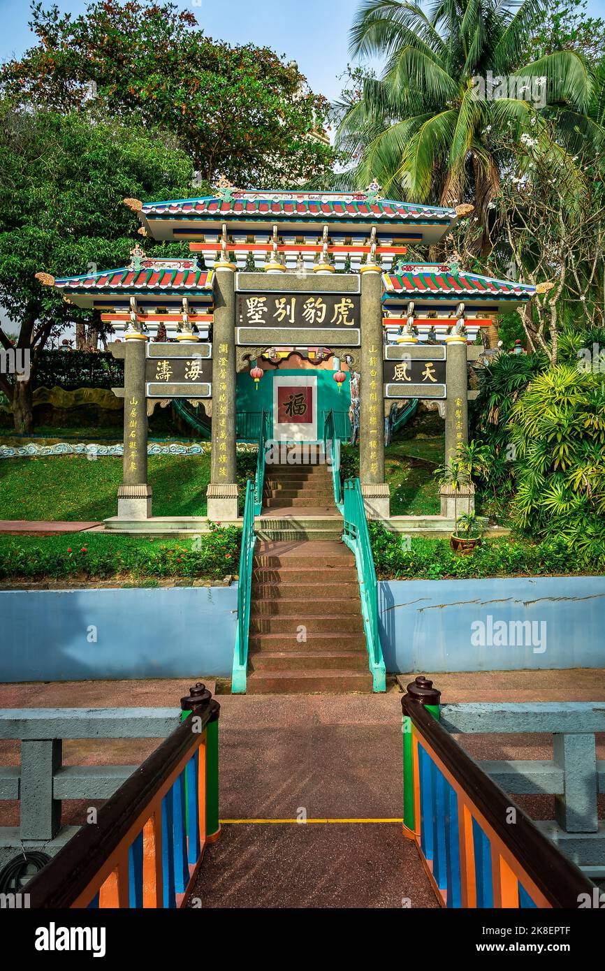 Chinese Pagoda and gateway by the Lake at Haw Par Villa. This park has ...