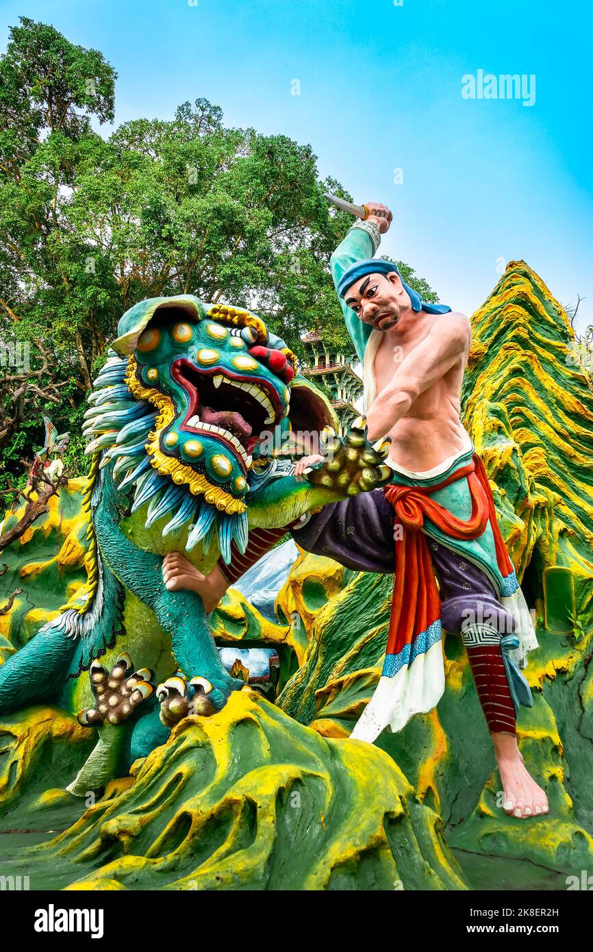 Sculpture depicting the legend of Wu Song killing a tiger at Haw Par ...