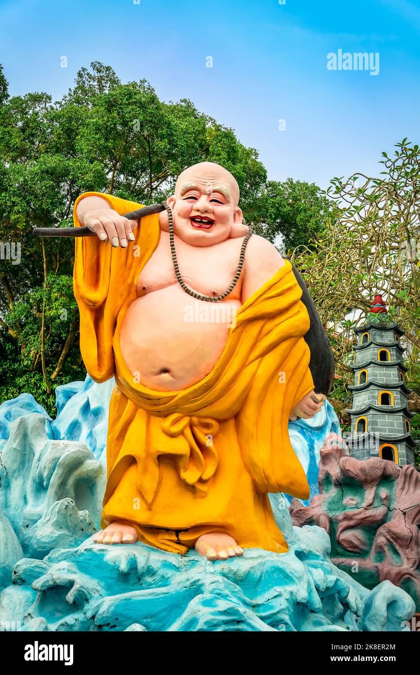Smiling Buddha statue at Haw Par Villa Theme Park. This park has ...