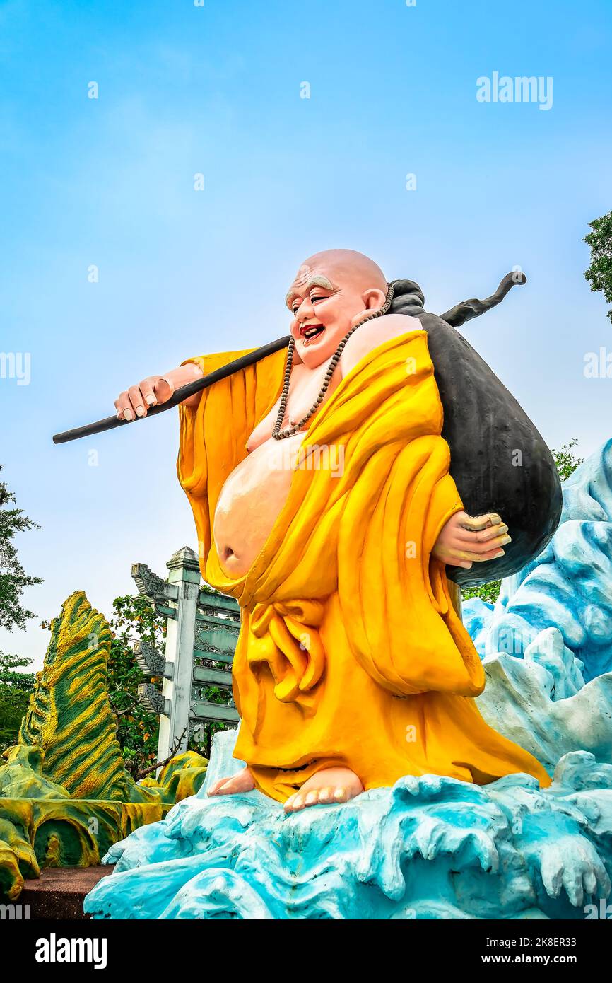 Smiling Buddha statue at Haw Par Villa Theme Park. This park has ...