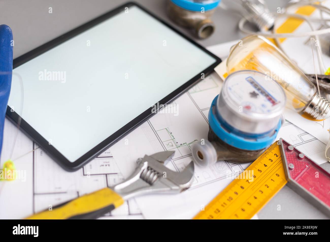 Tablet computer with architecture and construction tools and blueprints ...