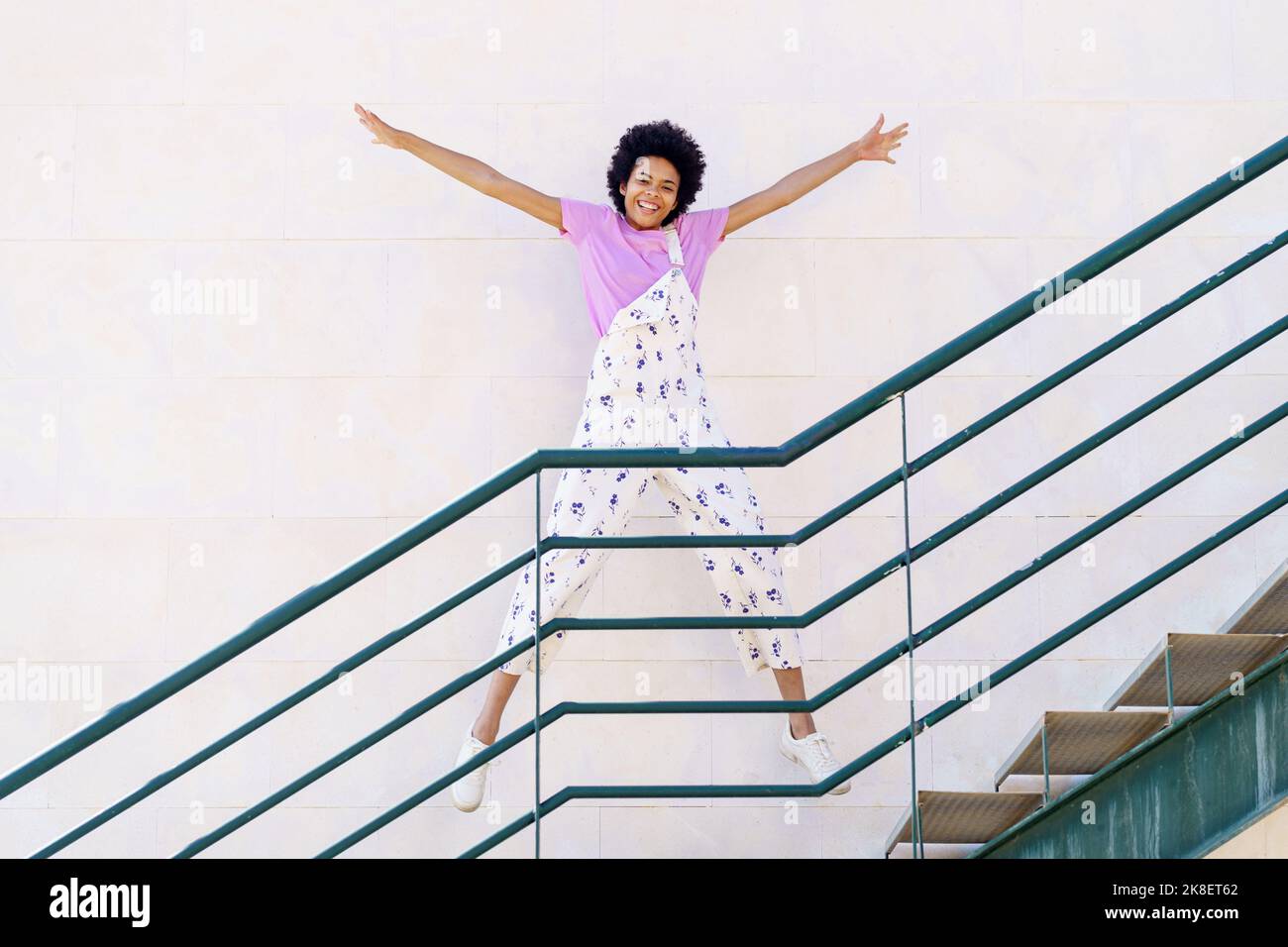Black woman jumping hi-res stock photography and images - Alamy
